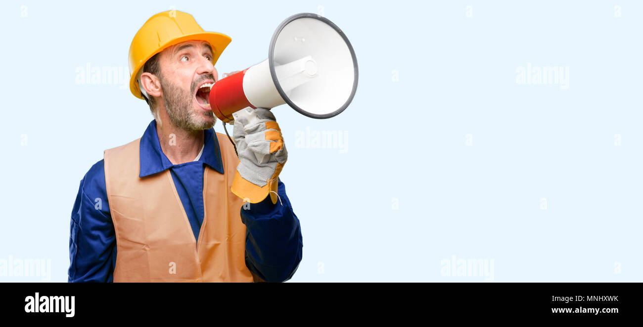 Senior engineer man, construction worker communicates shouting loud ...