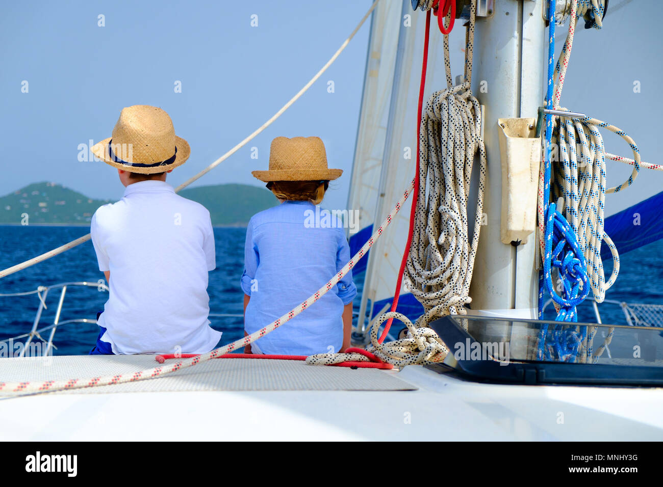 Back view of kids enjoying sailing on a luxury catamaran or yacht Stock ...