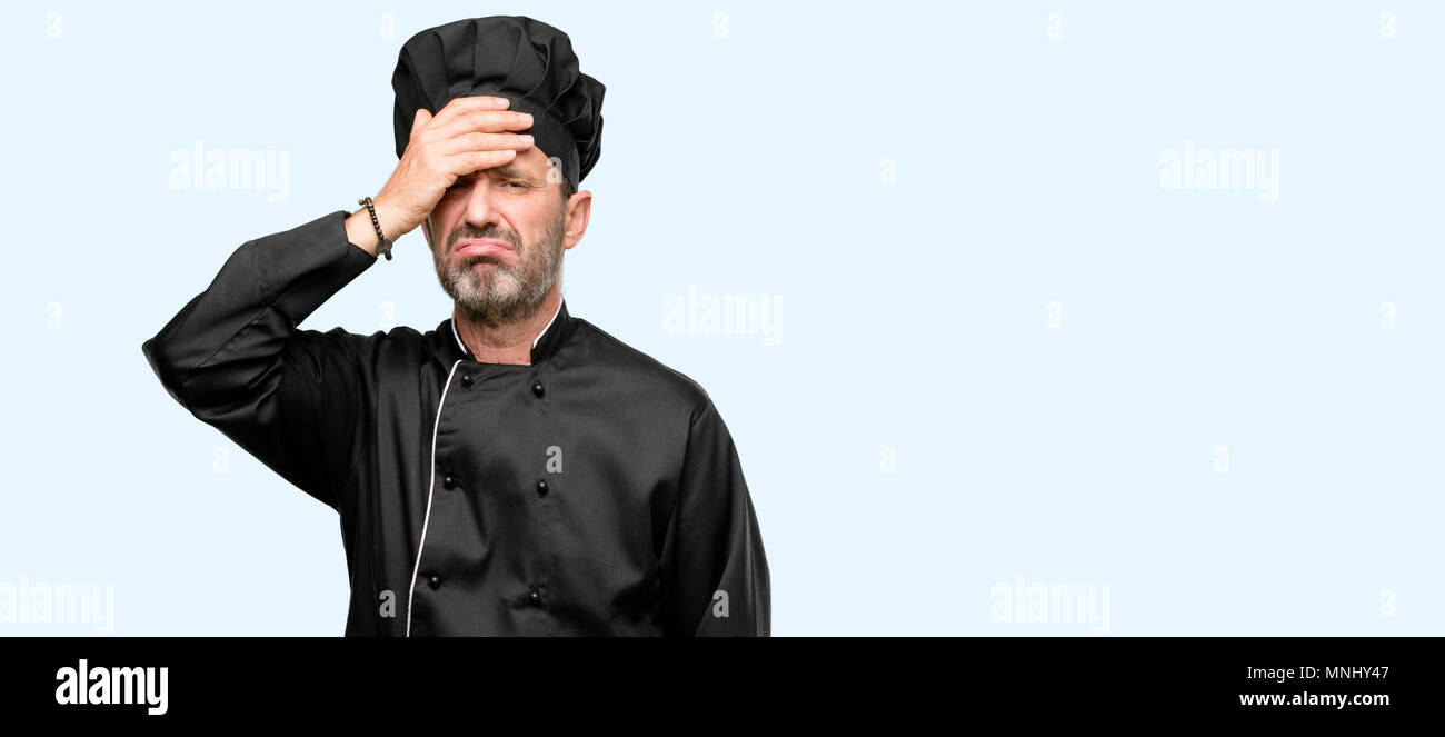 Senior cook man, wearing chef hat terrified and nervous expressing ...