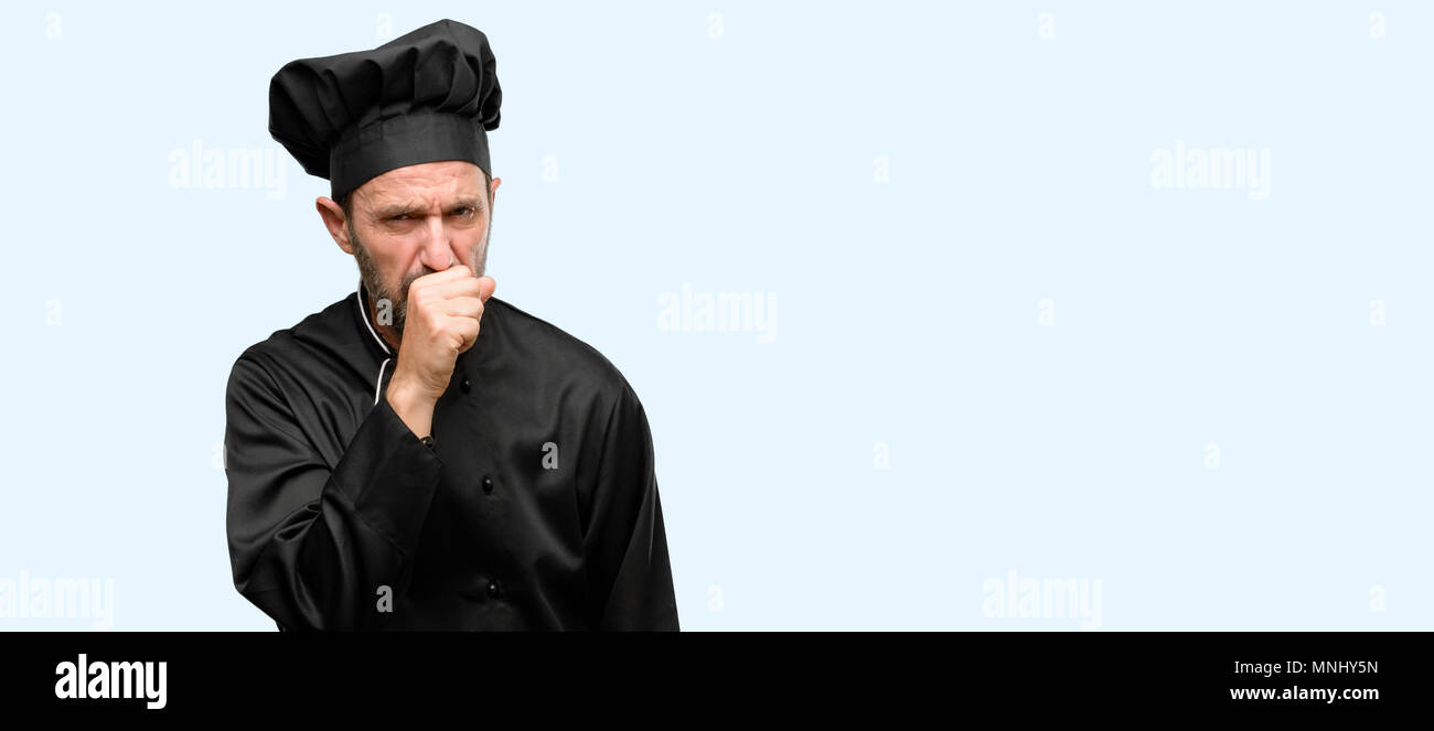 Senior cook man, wearing chef hat sick and coughing, suffering asthma ...