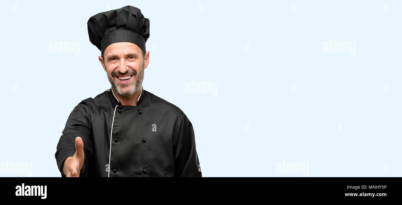 Cook kitchen shaking hands hi-res stock photography and images - Alamy