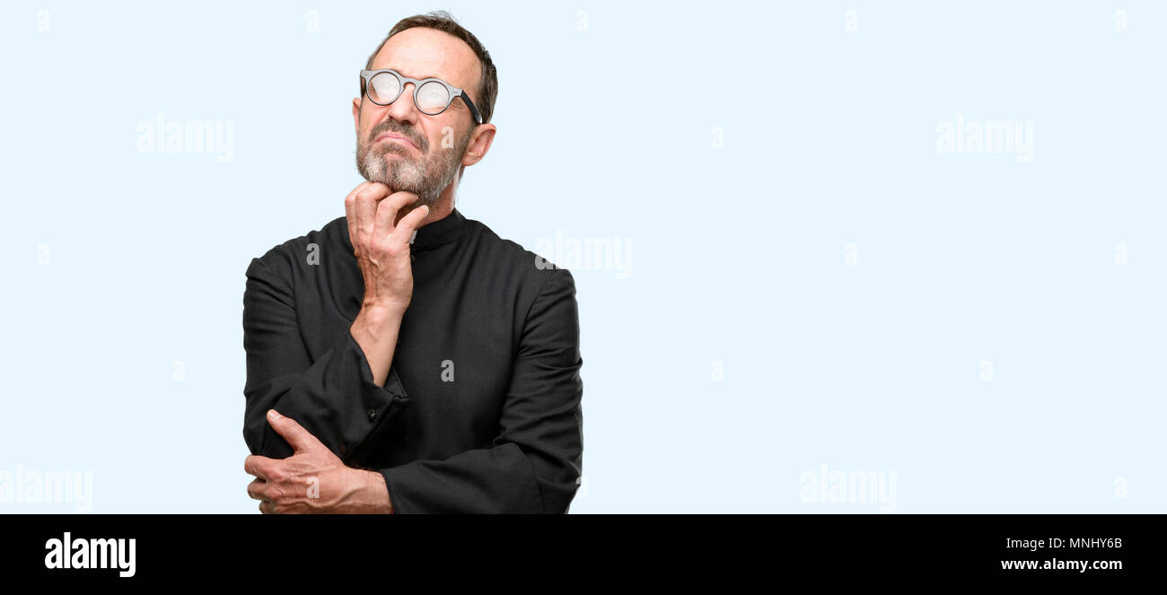 Priest religion man thinking and looking up expressing doubt and wonder ...