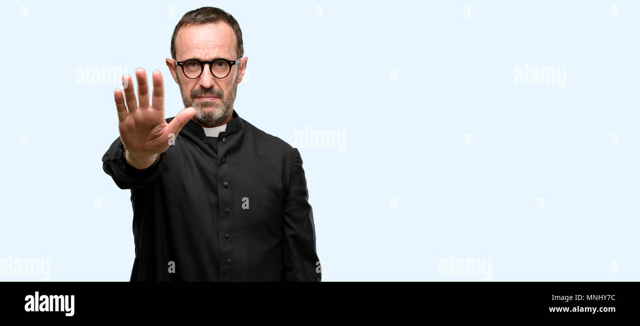 Priest religion man annoyed with bad attitude making stop sign with ...