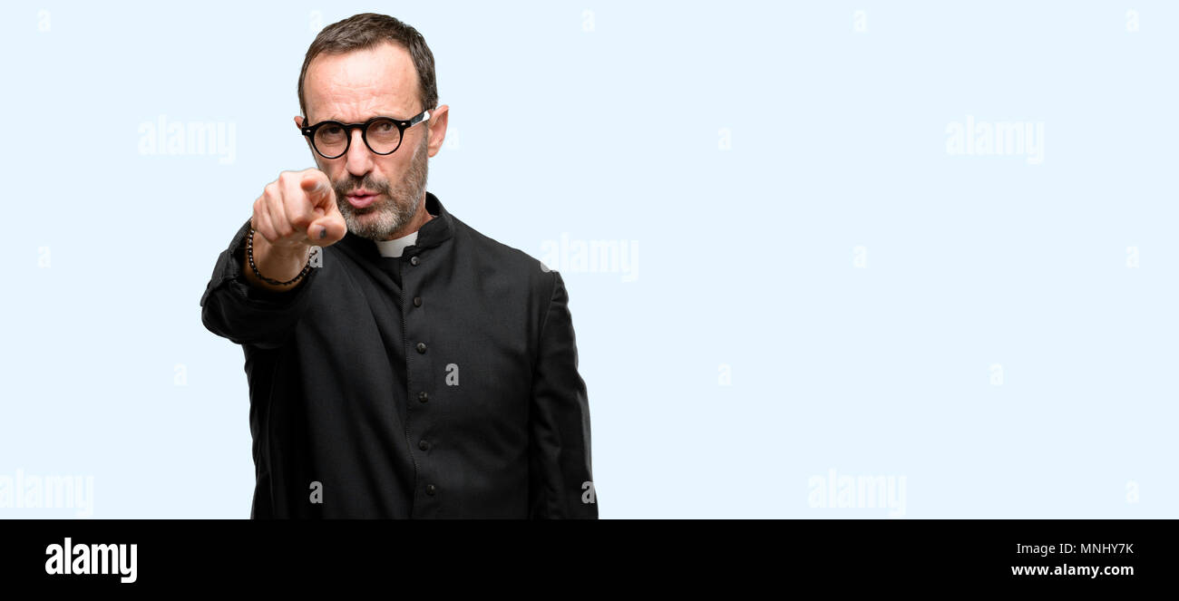 Priest religion man pointing to the front with finger isolated over ...