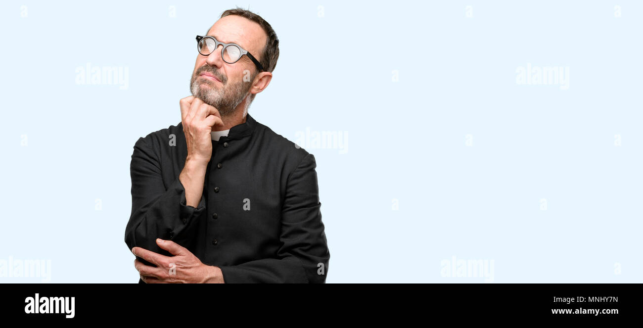 Priest religion man thinking and looking up expressing doubt and wonder ...