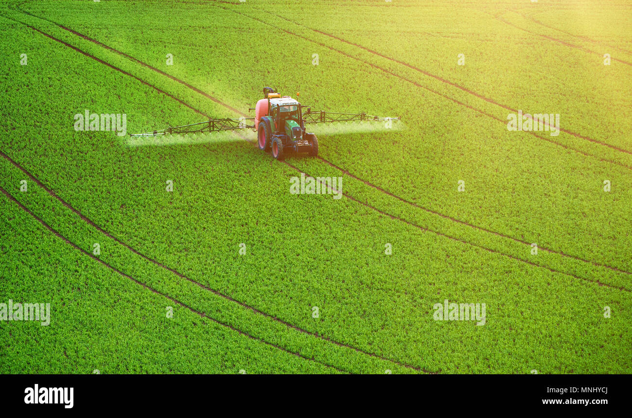 Farm machinery spraying insecticide Stock Photo - Alamy