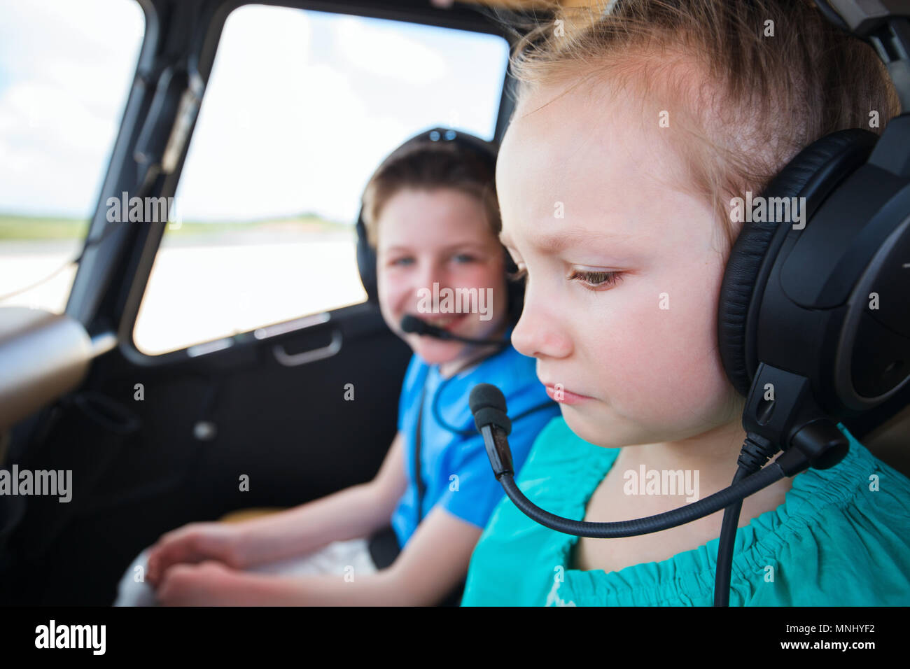 Kids at cabin of helicopter before flight with little girl , scared ...