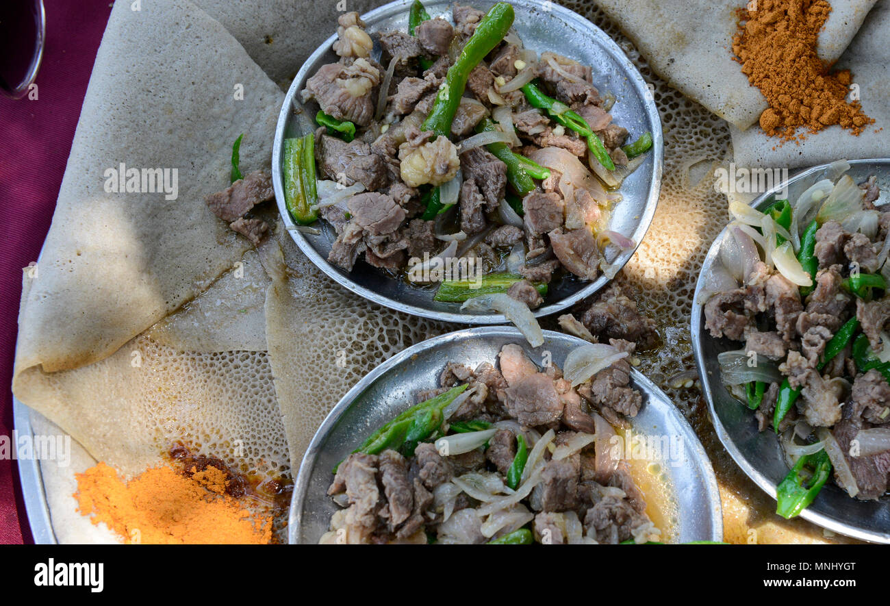 ETHIOPIA, national meal Injera with meat , onions, paprika and chillies ...