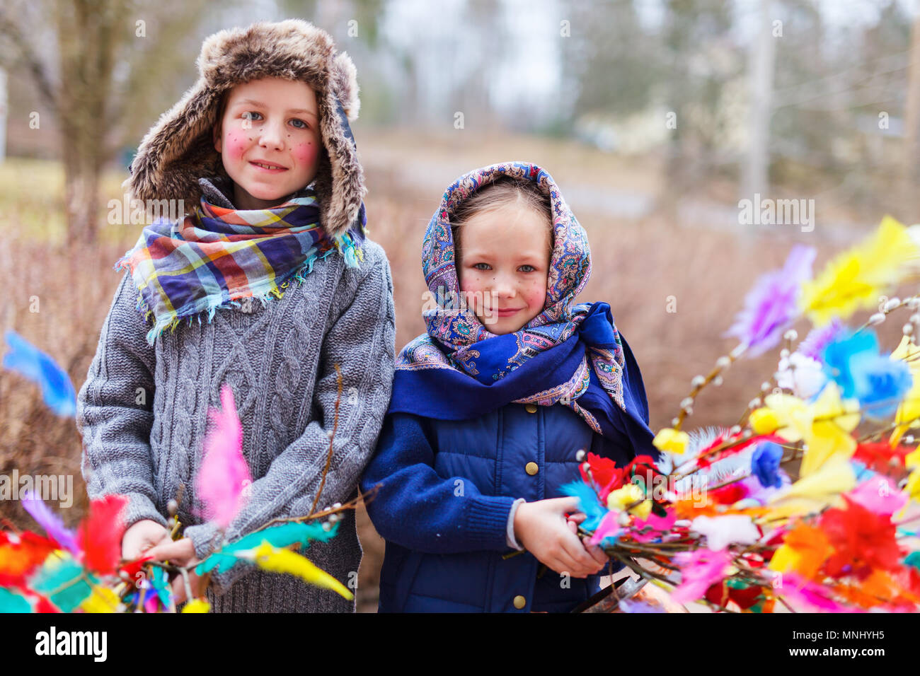 Kids outdoors dressed for Easter traditional celebration in Finland ...