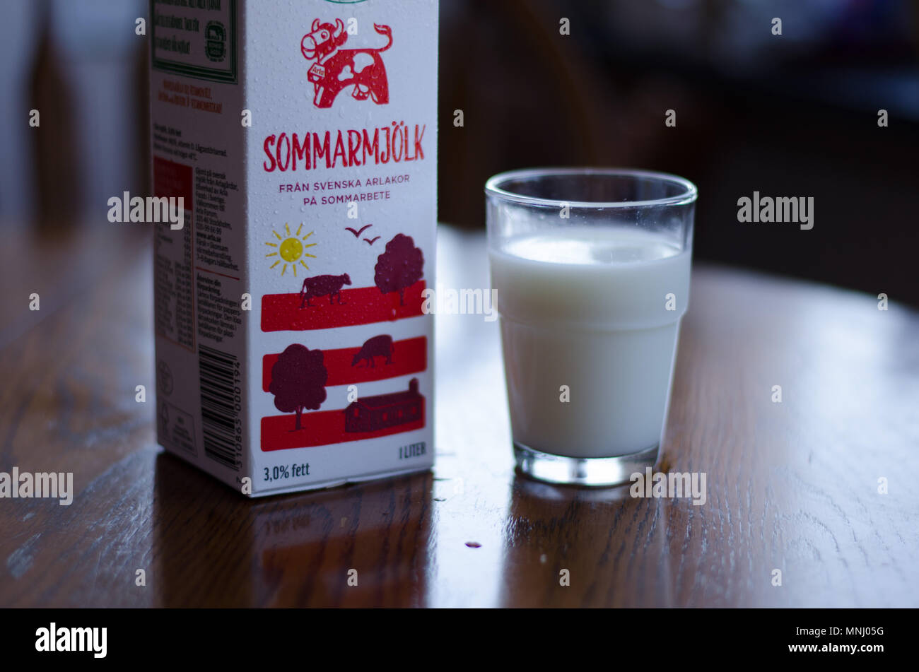 Stockholm, Sweden - 12 may 2018. A carton of milk and a glass of Arlas ...