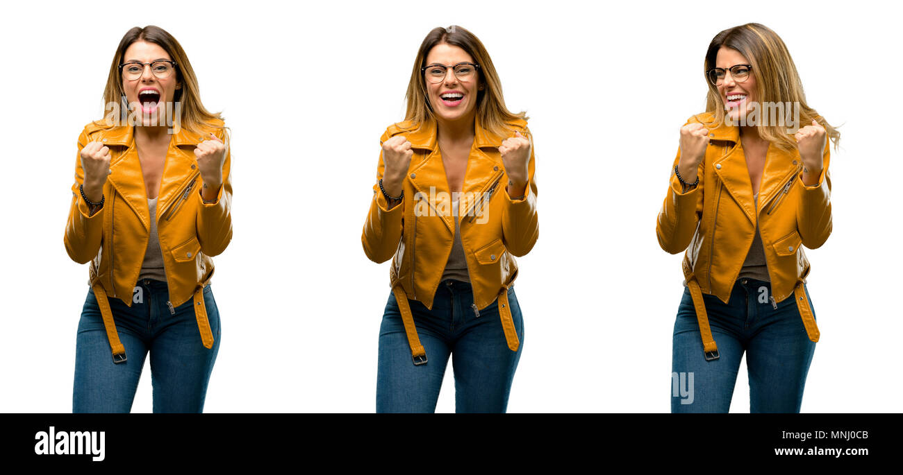 Beautiful young woman happy and excited expressing winning gesture ...