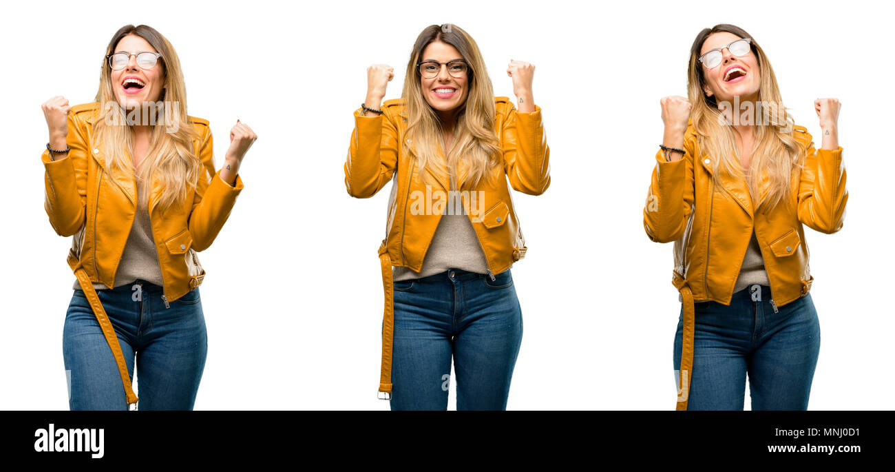 Beautiful young woman happy and excited expressing winning gesture ...