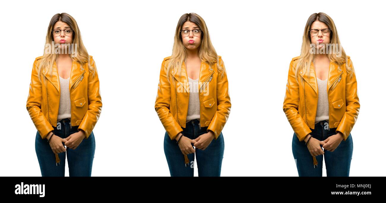 Beautiful young woman puffing out cheeks, having fun making funny face ...