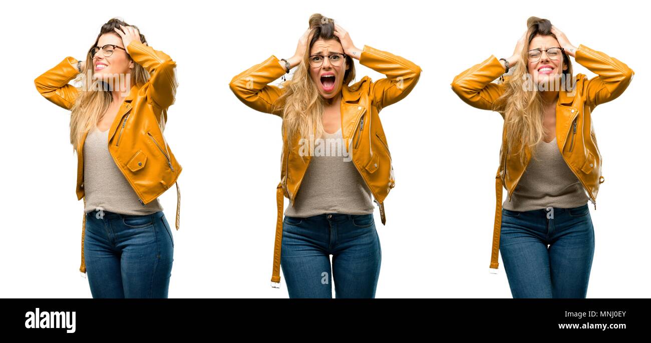 Beautiful young woman stressful keeping hands on head, terrified in ...