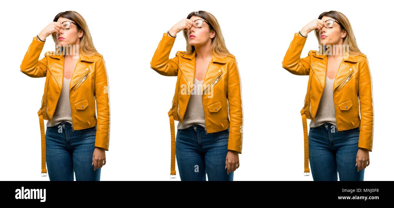 Beautiful young woman with sleepy expression, being overworked and ...