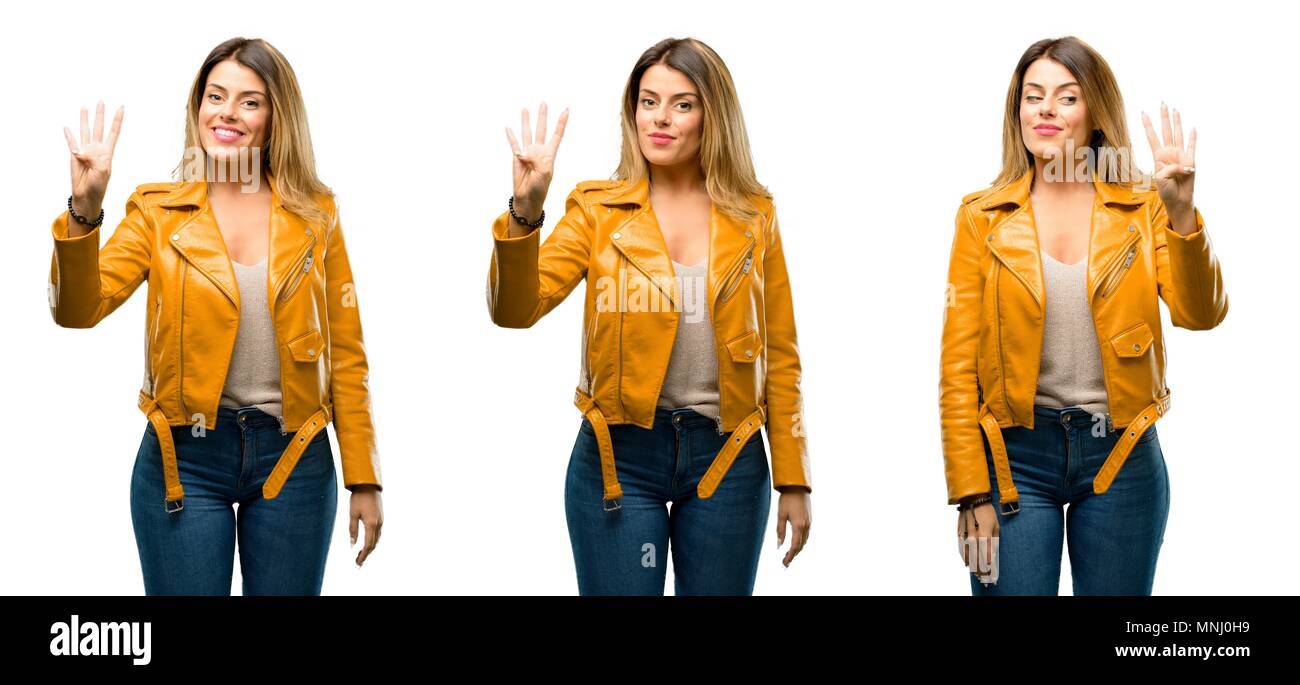 Beautiful young woman raising his finger, is the number four over white ...