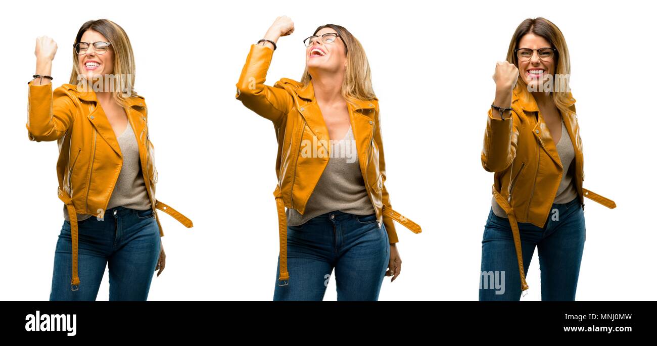 Beautiful young woman happy and excited expressing winning gesture ...