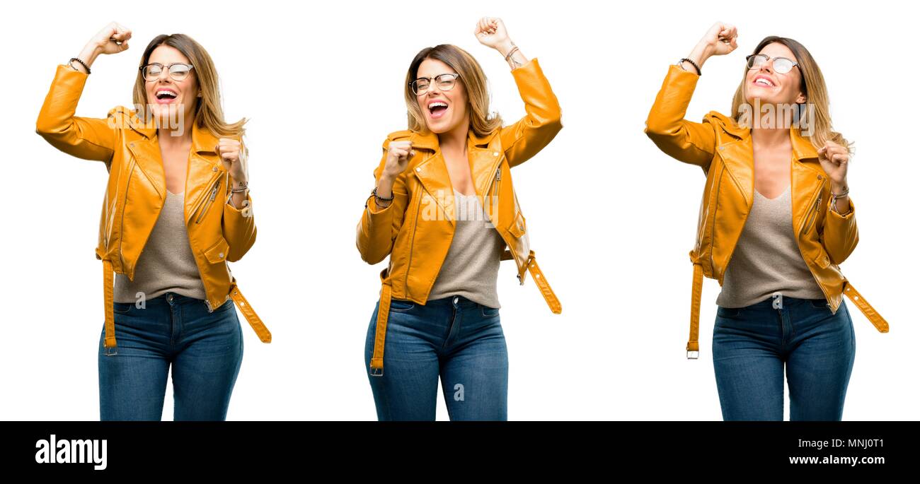 Beautiful young woman happy and excited expressing winning gesture ...