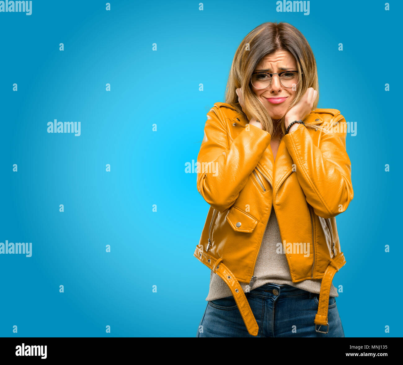 Beautiful young woman with sad and upset expression, unhappy, blue ...
