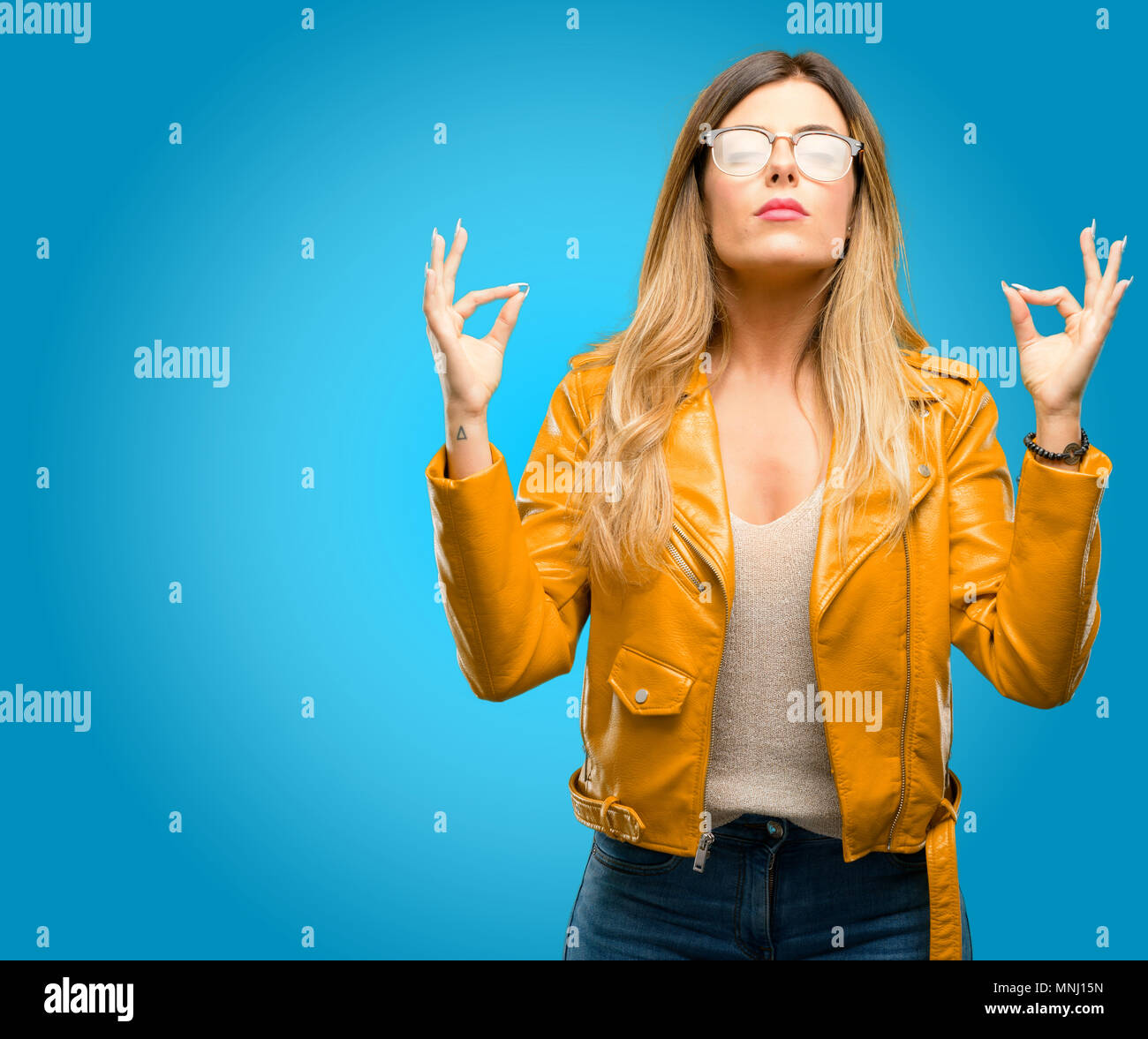 Beautiful young woman doing ok sign gesture with both hands expressing ...