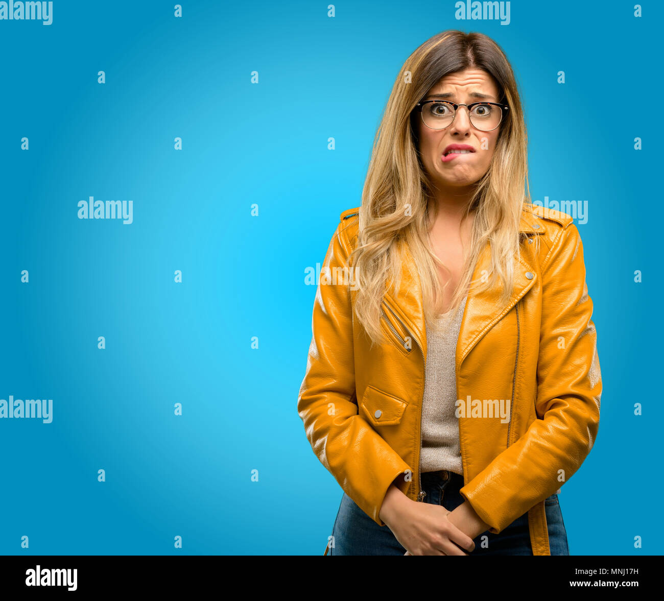 Beautiful young woman doubt expression, confuse and wonder concept ...