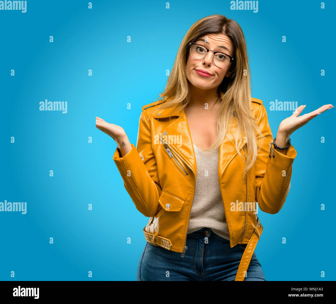 Beautiful young woman doubt expression, confuse and wonder concept ...