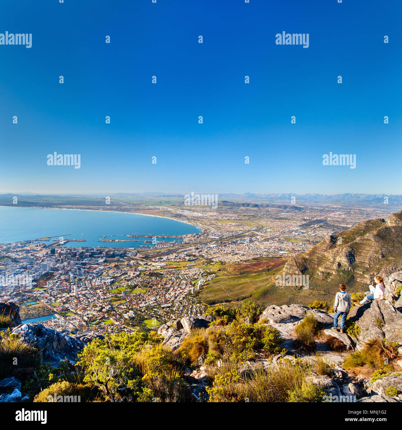 Two kids enjoying breathtaking views of Cape Town from top of Table ...