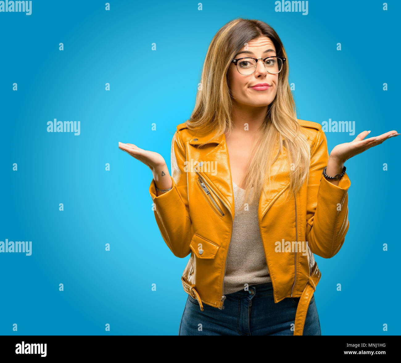 Beautiful young woman doubt expression, confuse and wonder concept ...