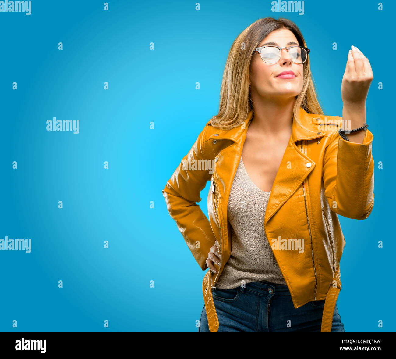 Beautiful young woman angry gesturing typical italian gesture with hand ...