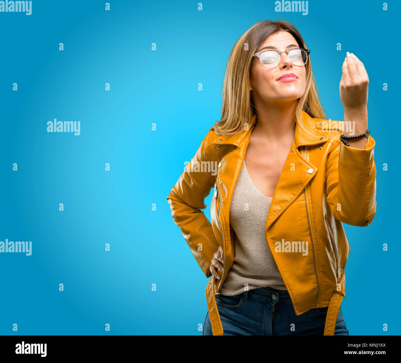 Beautiful young woman angry gesturing typical italian gesture with hand ...