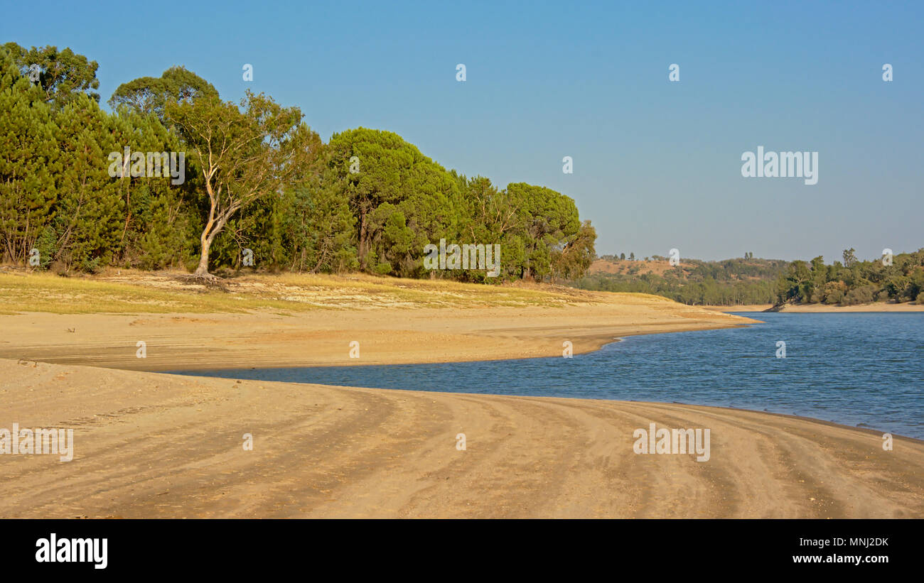 Sunny landscape with maquis vegetation on the beach of `Baragem de ...