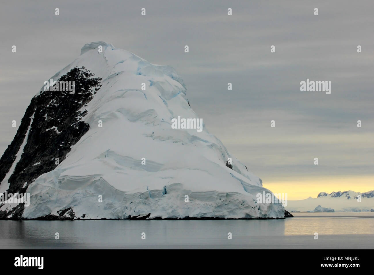 Antarctica landscape, icebergs, mountains and ocean at sunrise Stock ...