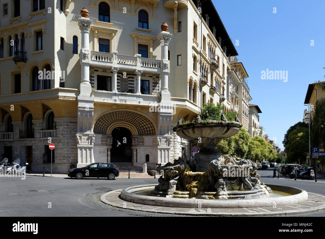 Piazza Mincio, with the Fontana delle Rane and a building with an ...