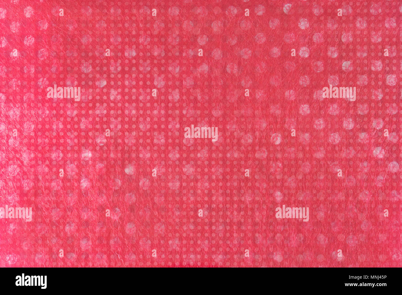 Texture of a photographed paper with white dots, behind lined textile ...