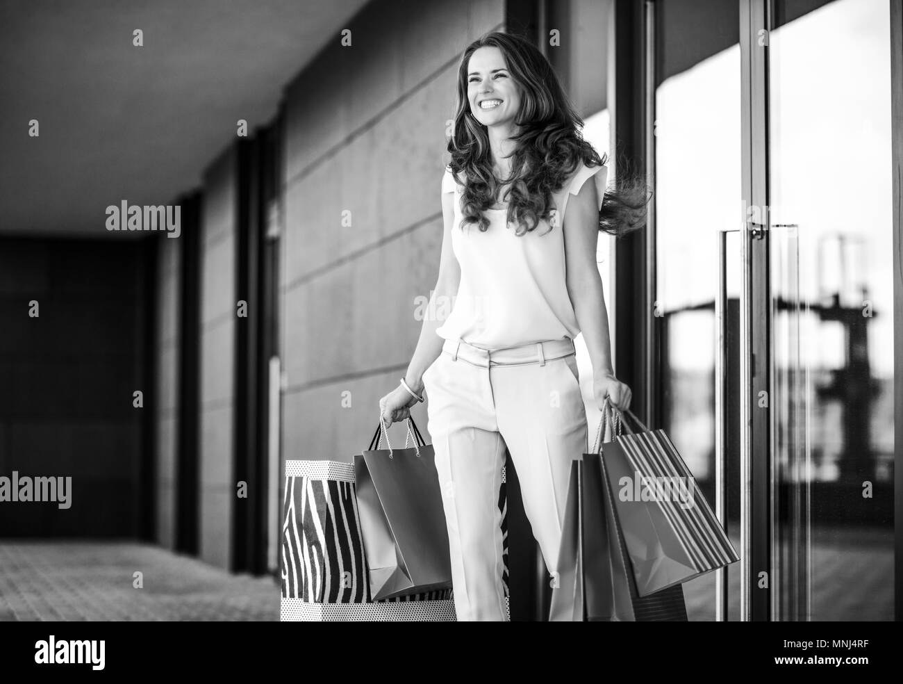 Female shopper out shopping Black and White Stock Photos & Images - Alamy