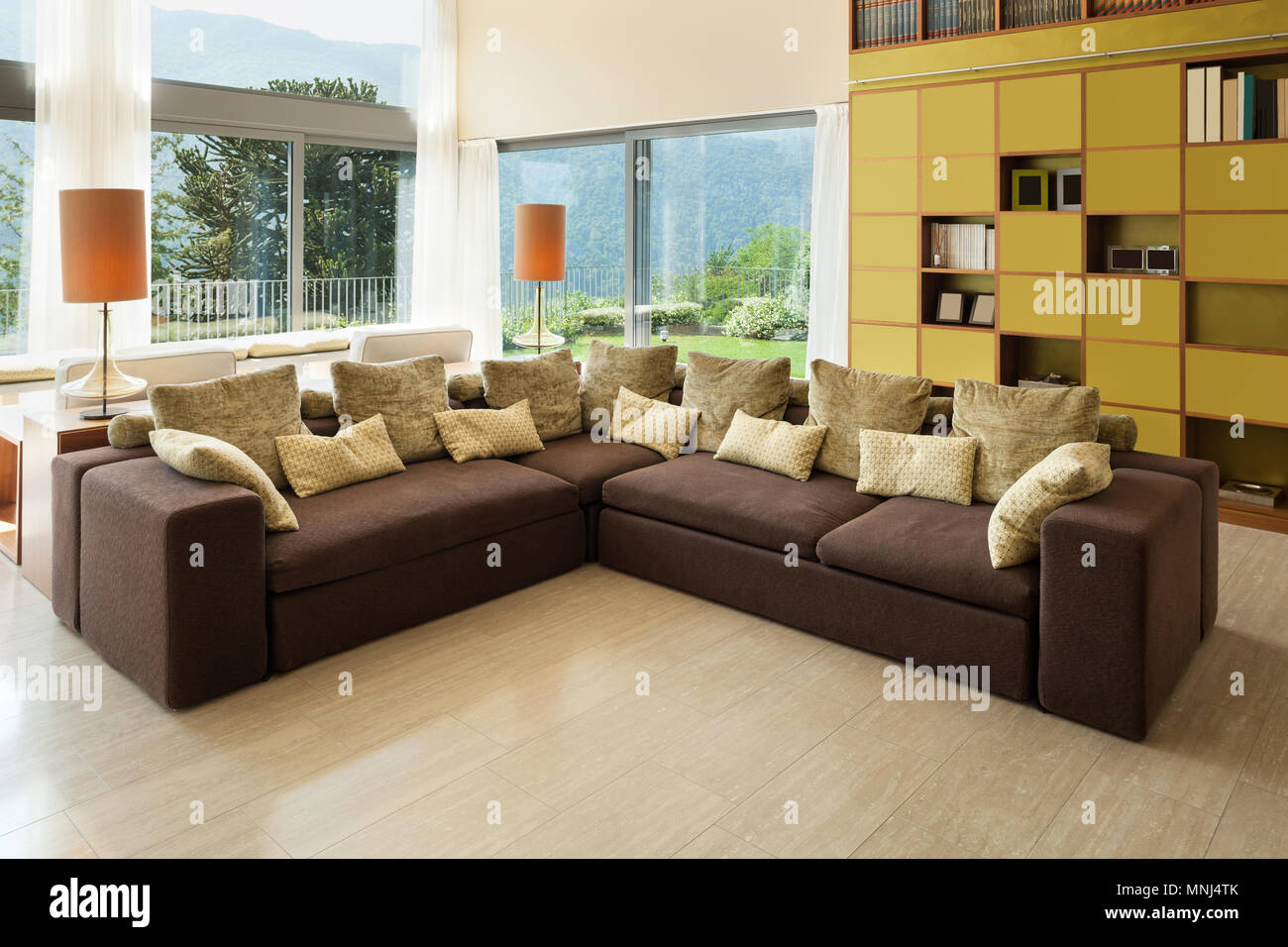Interior of a modern living room, comfortable divan Stock Photo - Alamy