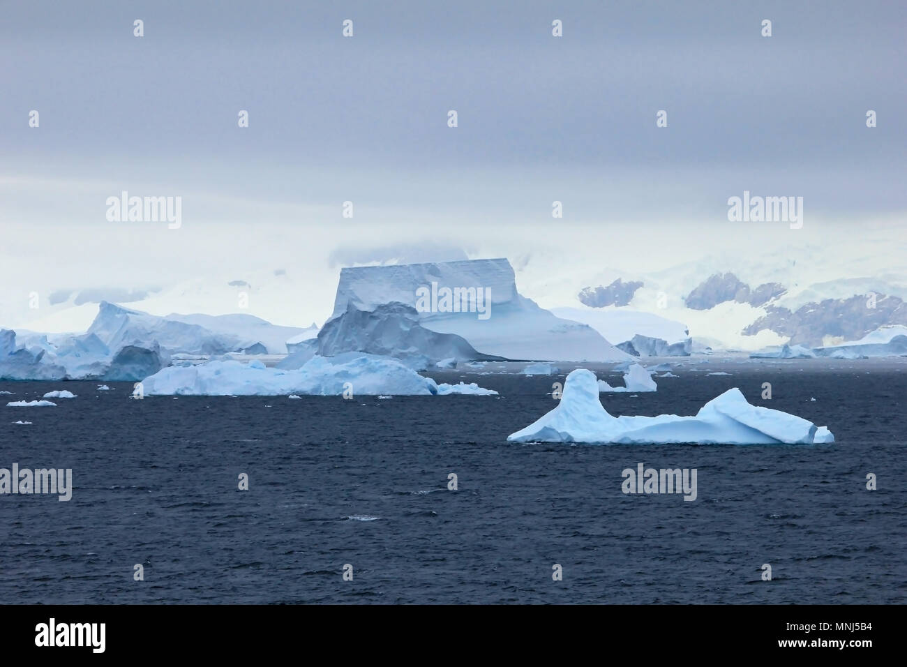 Antarctic landscape, icebergs, mountains and ocean, Antarctic Peninsula ...