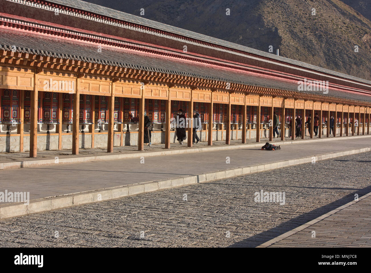 Tibetan pilgrims spinning prayer wheels and prostrating, Labrang ...