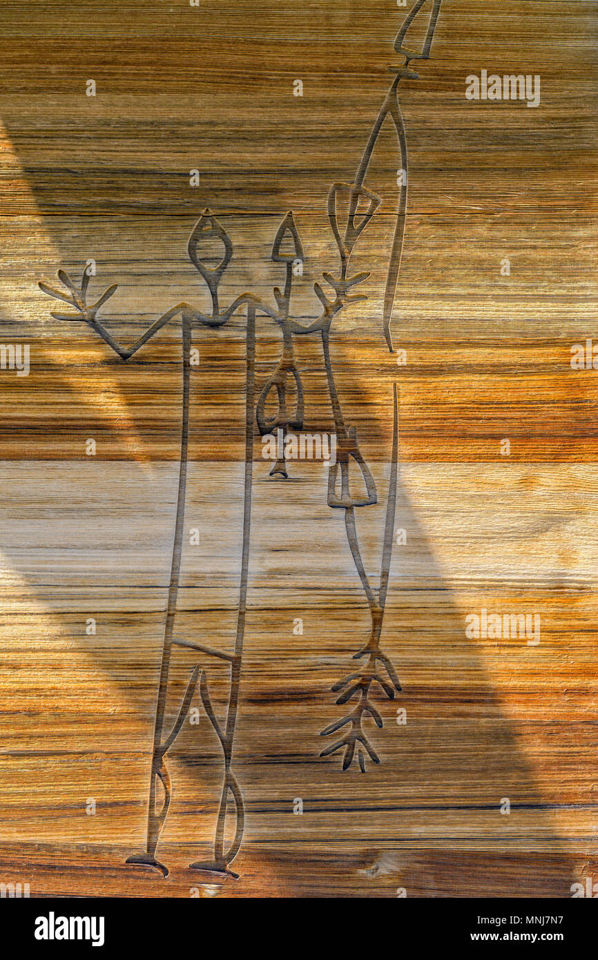 Native pictograph carved in wood at the Writing on Stone Provincial ...