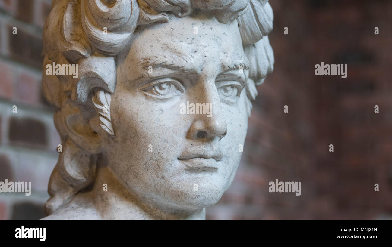 Carved marble face in Greek style Stock Photo - Alamy