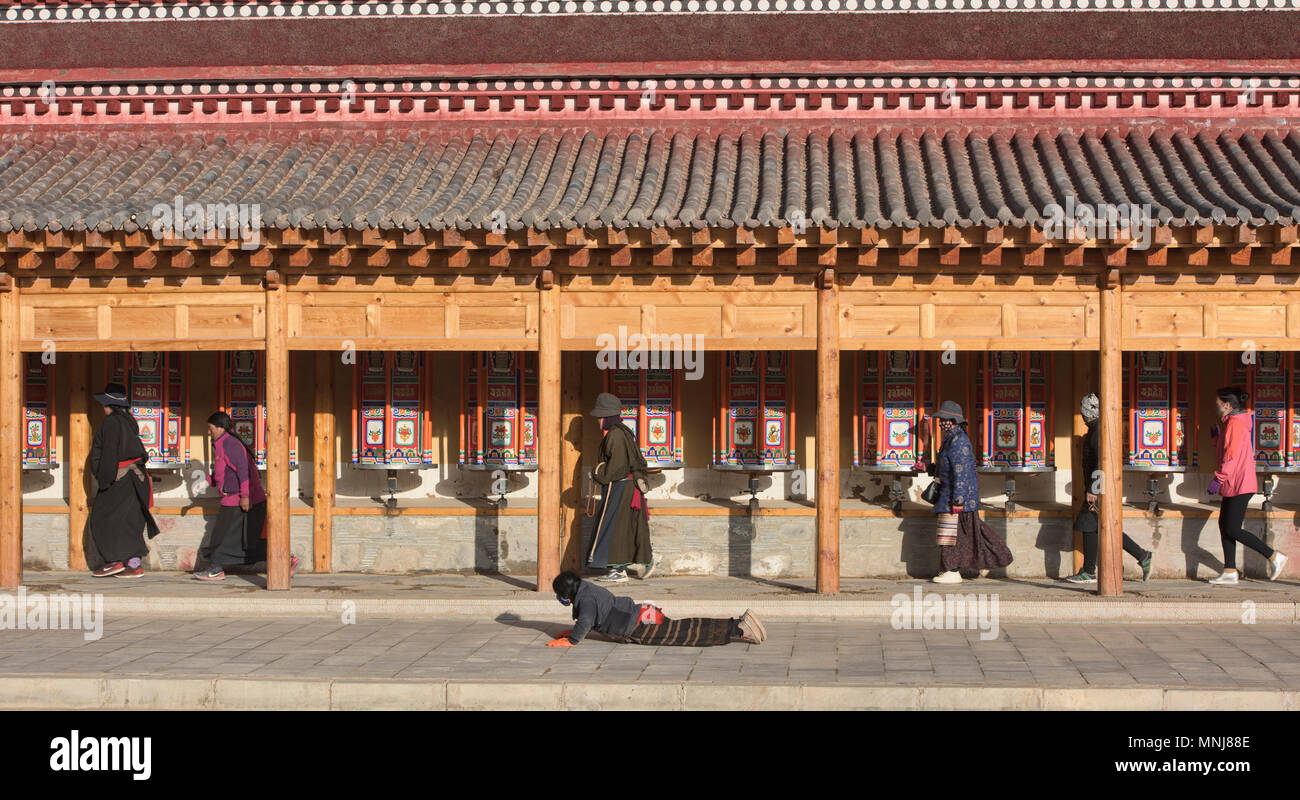 Tibetan pilgrims spinning prayer wheels and prostrating, Labrang ...