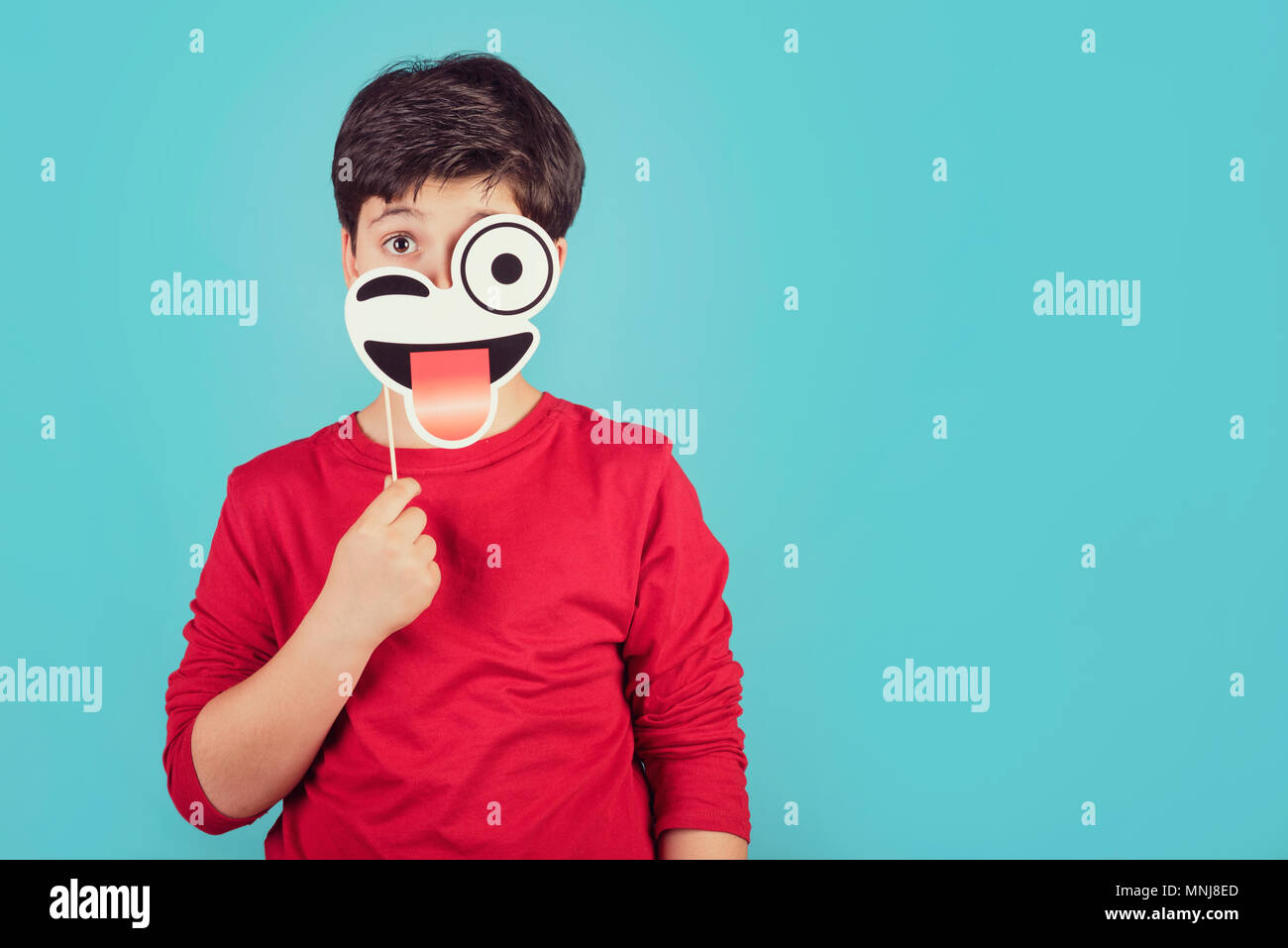 funny and smiling child on blue background Stock Photo - Alamy