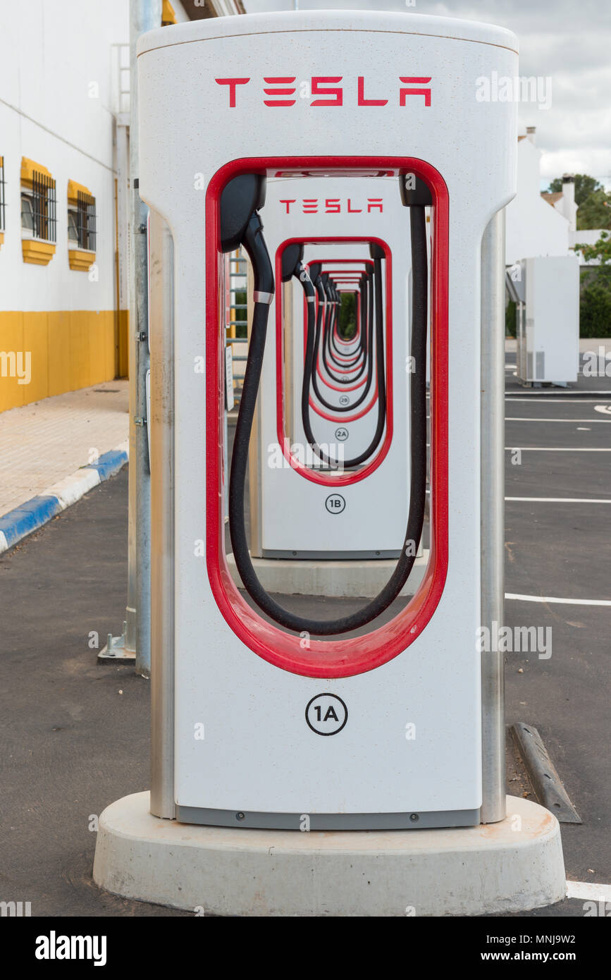 Details of a Tesla electric supercharger stand at a gas station in ...