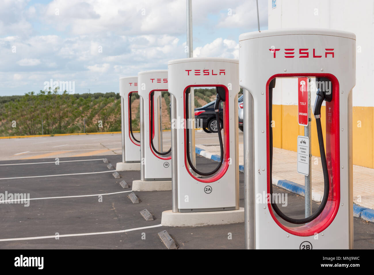 Details of a Tesla electric supercharger stand at a gas station in ...