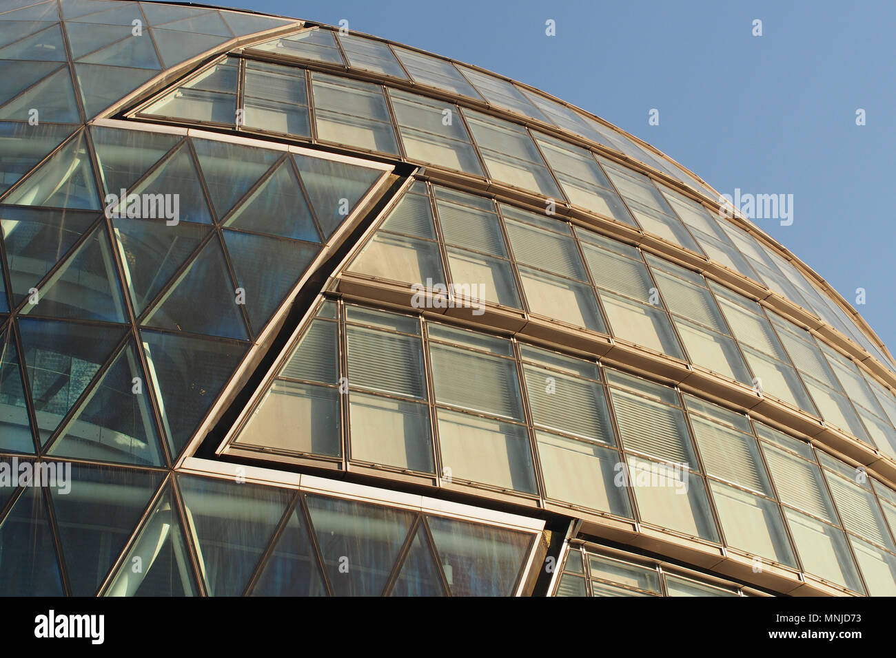 Close up of windows and window frames of City Hall, London in evening ...