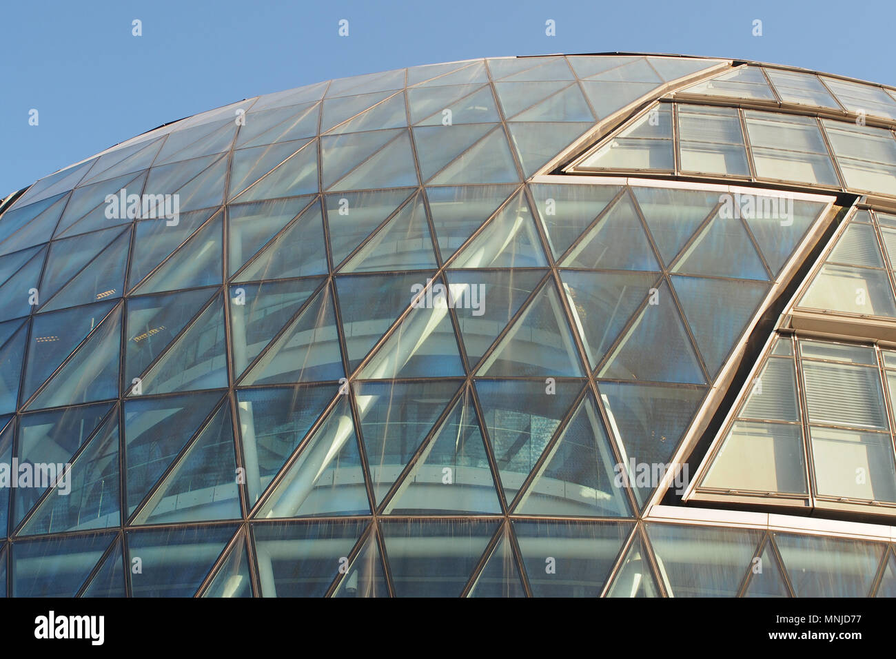 Close up of windows and window frames of City Hall, London in evening ...