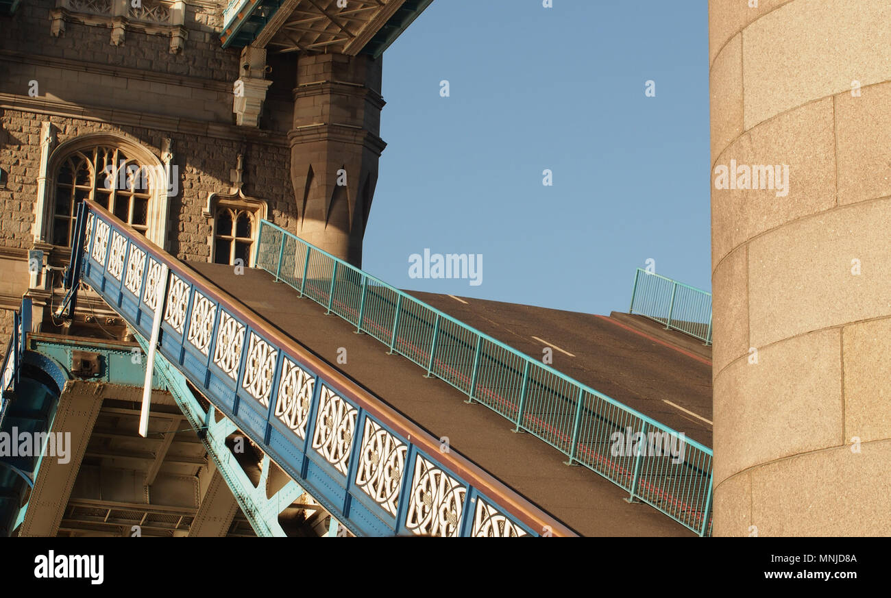 A view of the raised road of Tower Bridge, London from the pavement on ...