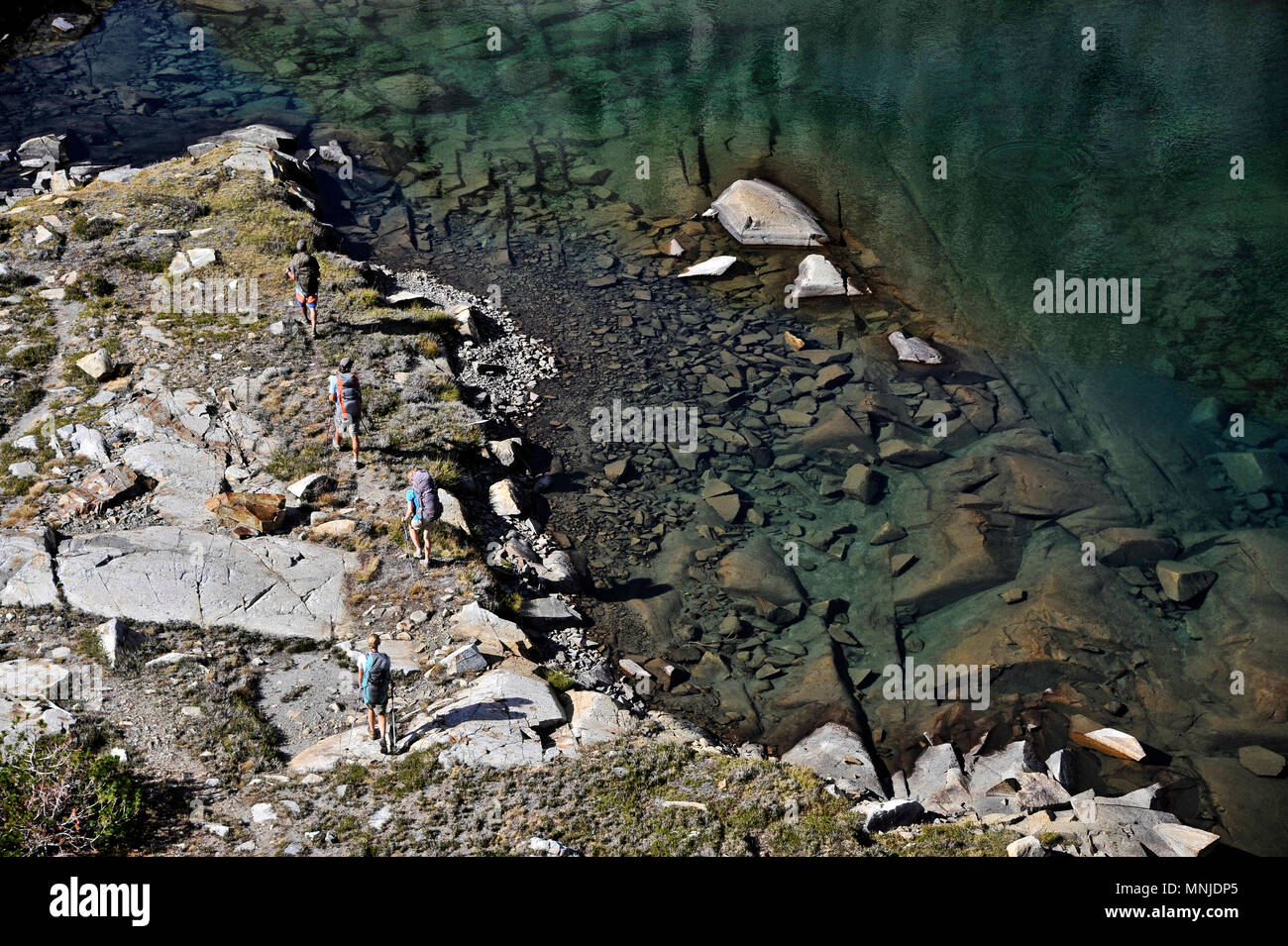 Backpackers hike to Twin Island Lakes near Mt Ritter while on a two ...