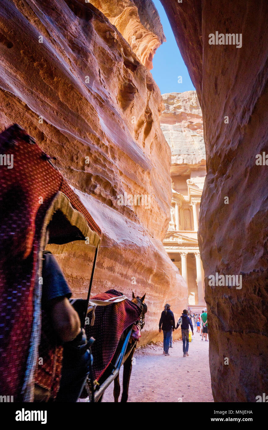 Horse drawn carriage approaching Al-Khazneh (The Treasury) through Al ...