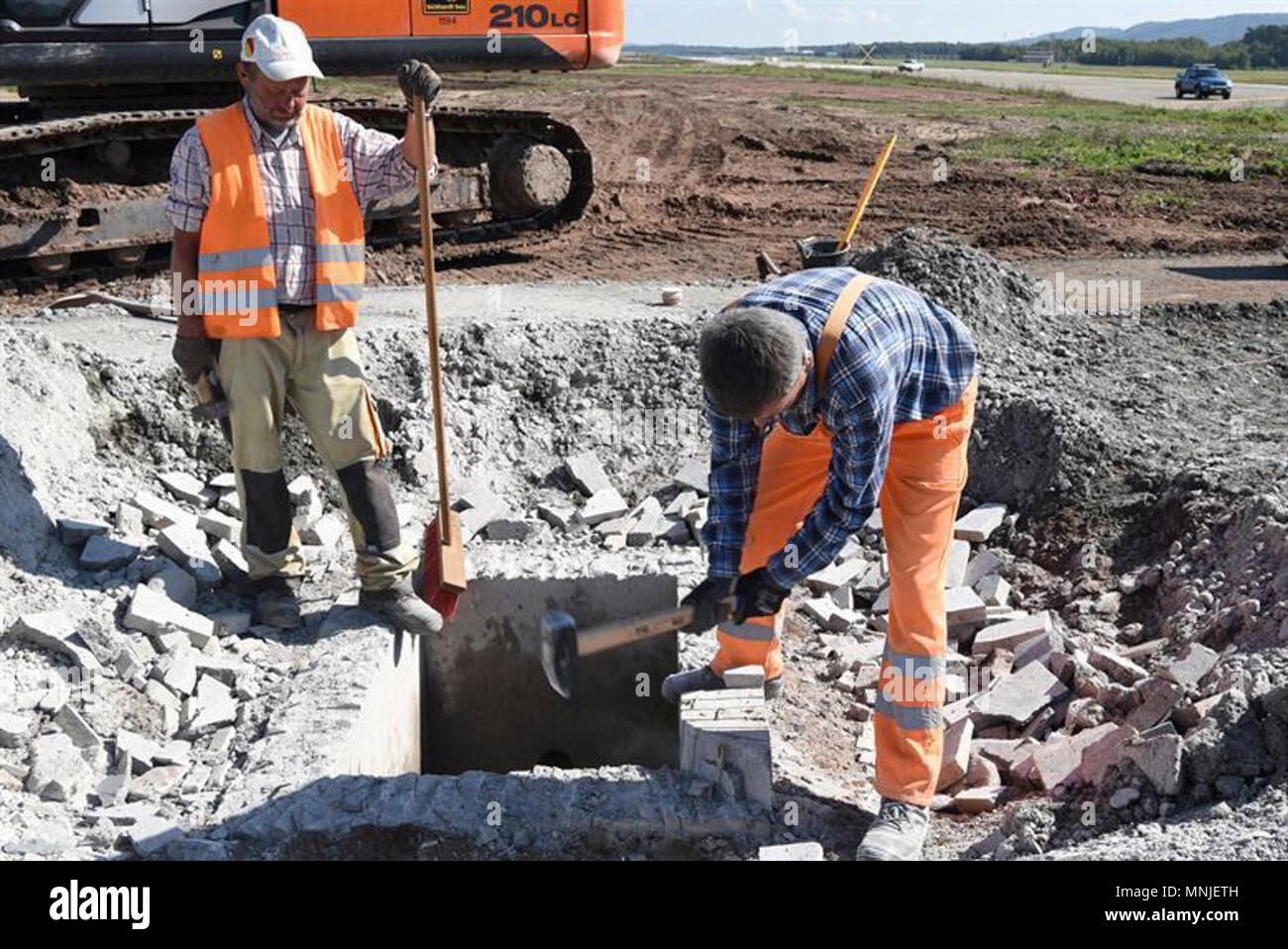 Wislaw and Dirk, German contract workers, lay the foundation for the ...
